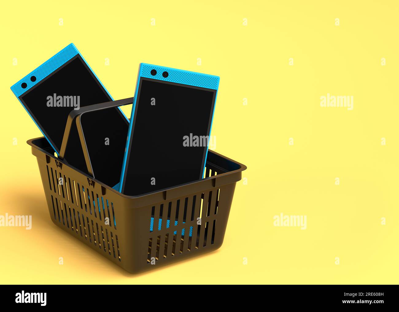 Gamer gears like mobile phones in plastic basket on yellow table ...