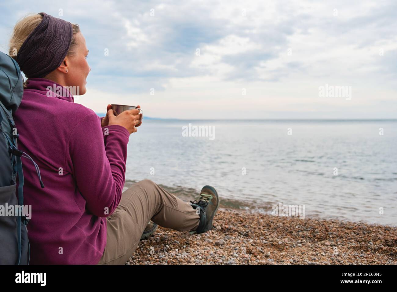 Hiking tourism adventure. Backpacker woman resting after hiking looking ...