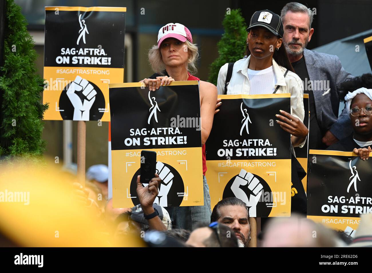 New York, USA. 25th July, 2023. Members of SAG-AFTRA hold signs as they ...