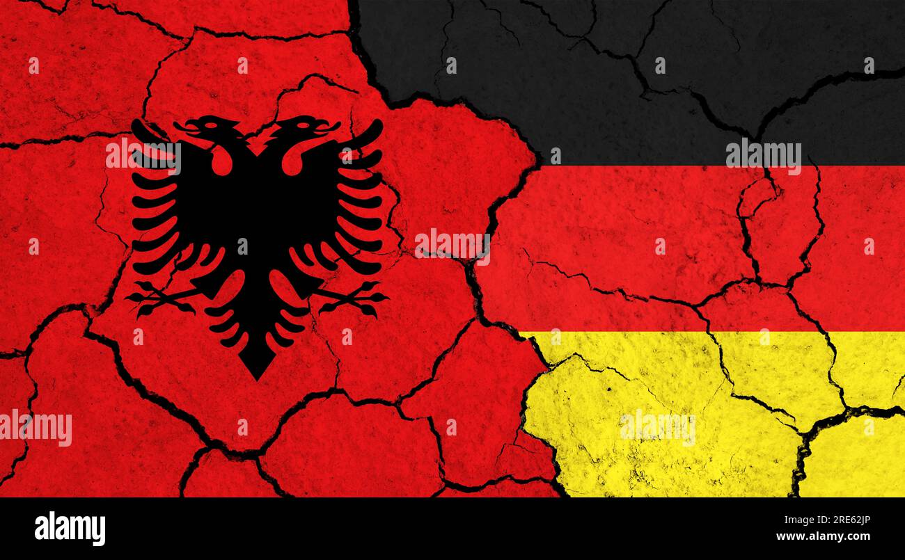 Flags of Albania and Germany on cracked surface - politics ...