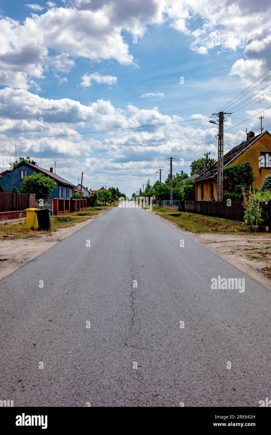 One single empty Polish village road, no cars, rural area community ...