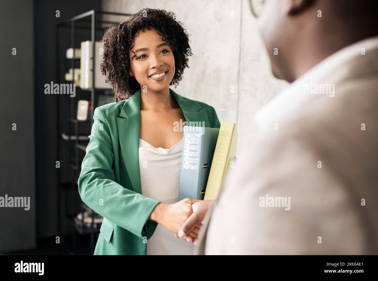 Black Woman Handshaking With Man Meeting For Job Interview Indoor Stock ...