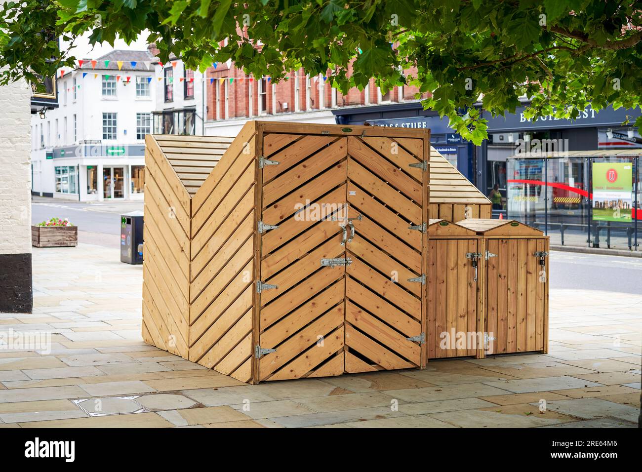 Small wooden sheds made to store commercial recycling and waste bins ...