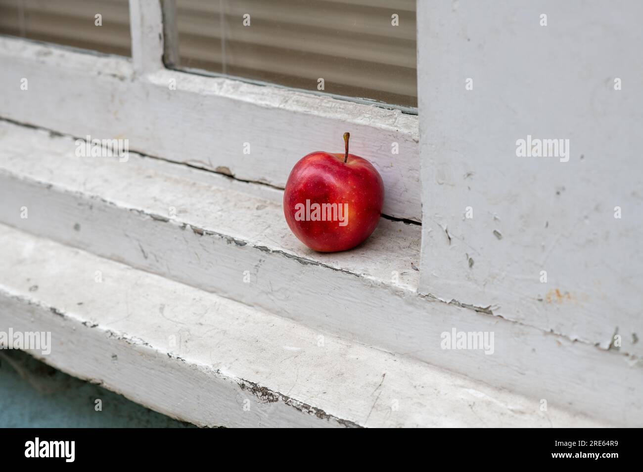 Red apple on a window ledge, in Oxford Stock Photo - Alamy