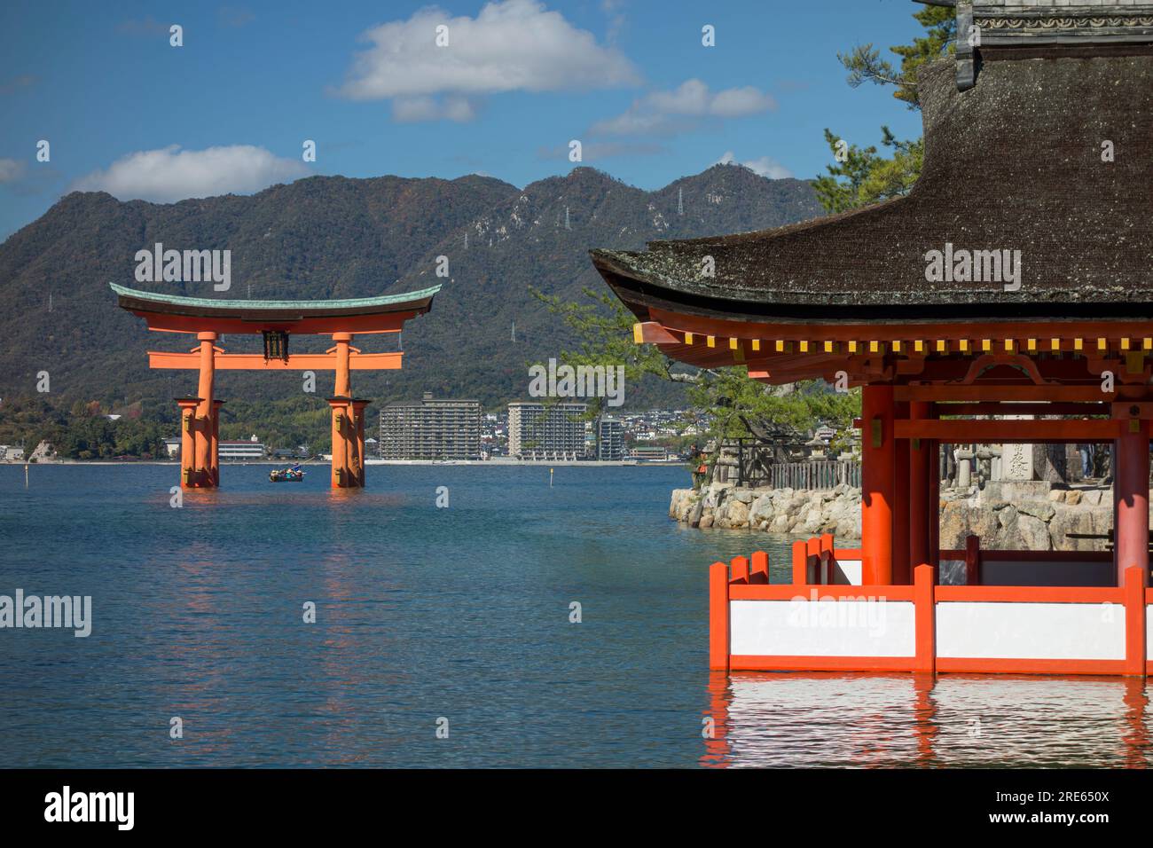 A building and floating torii gate at high tide at Itsukushima Shinto ...