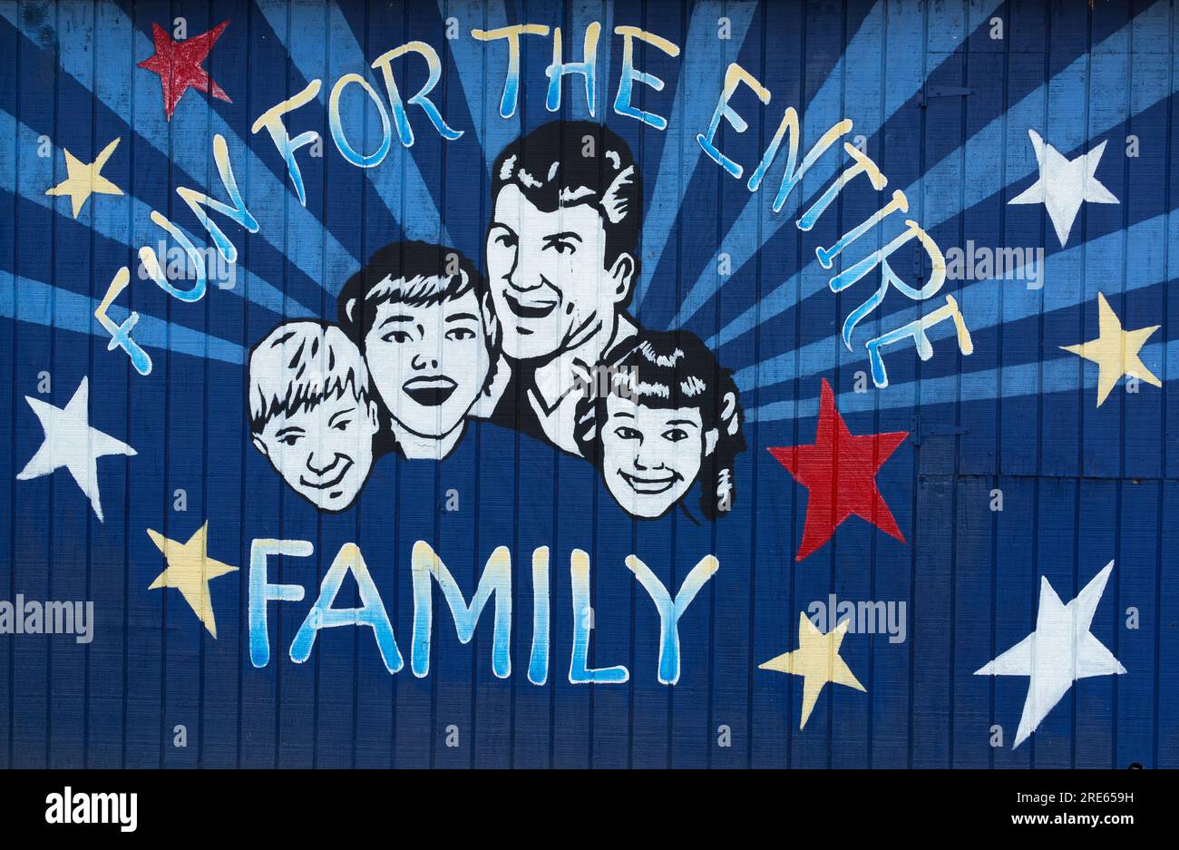 A sign reading "FUN FOR THE ENTIRE FAMILY" on a building at the ...