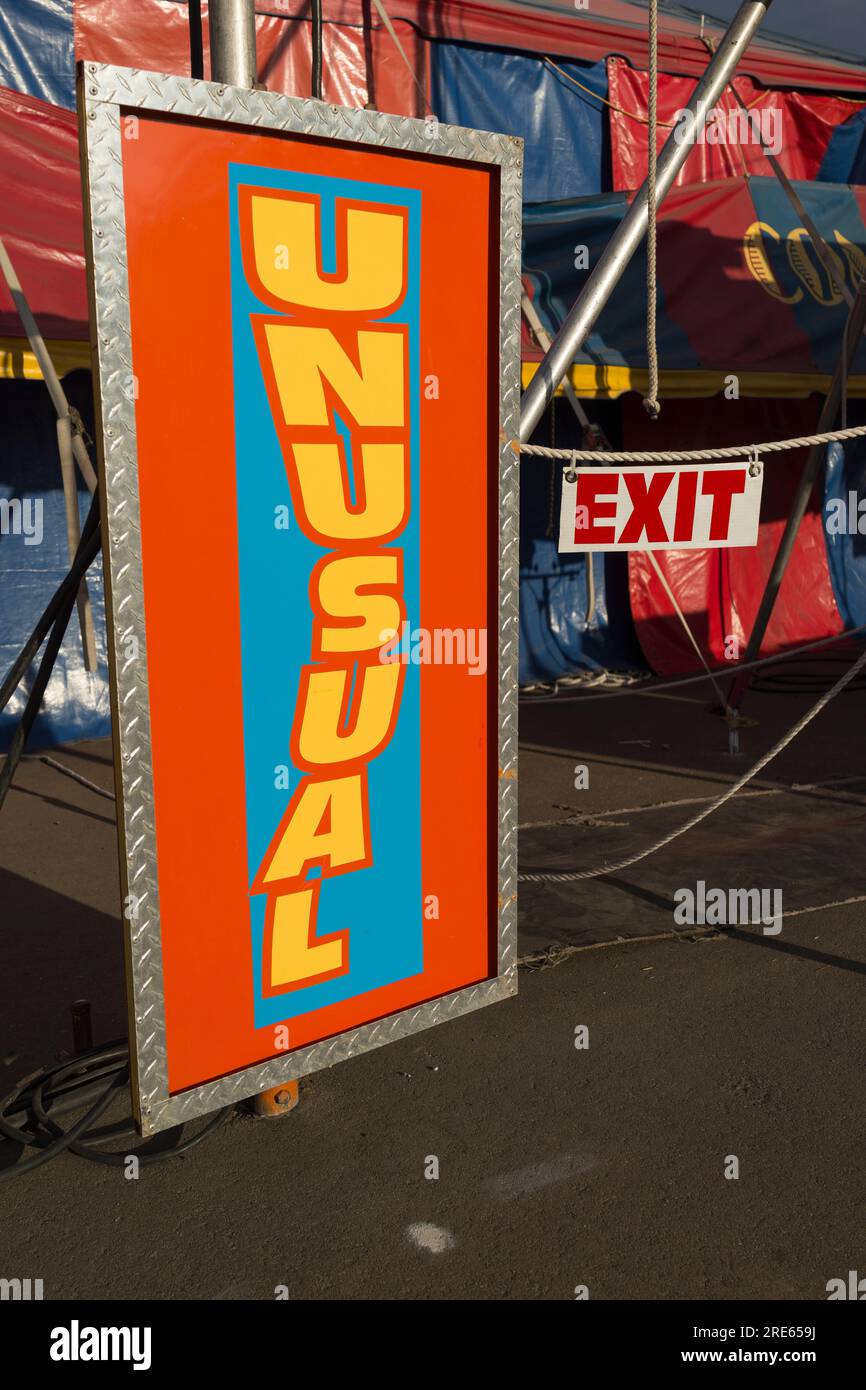 A sign reading "UNUSUAL" on the midway at the Minnesota State Fair ...