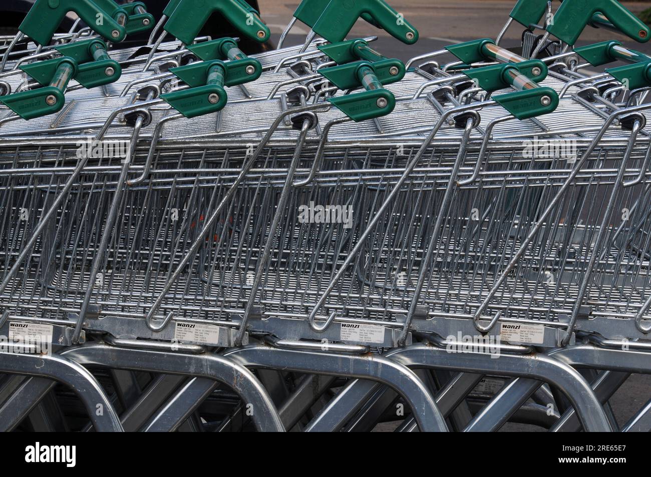 Morrisons supermarket shopping trolleys parked in trolley bay Stock ...