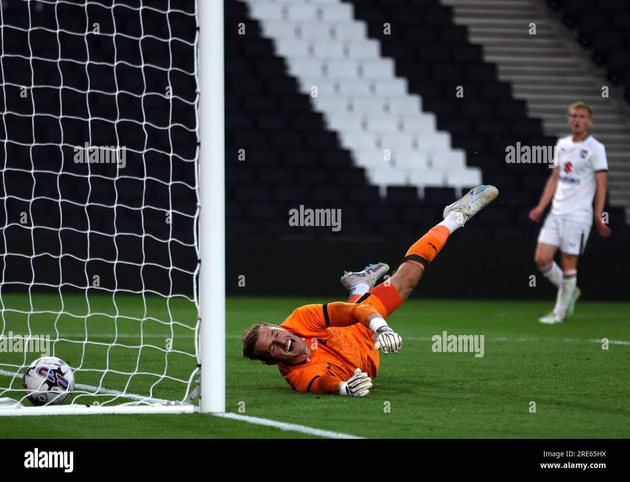 Milton Keynes Dons goalkeeper Craig MacGillivray concedes their side's ...