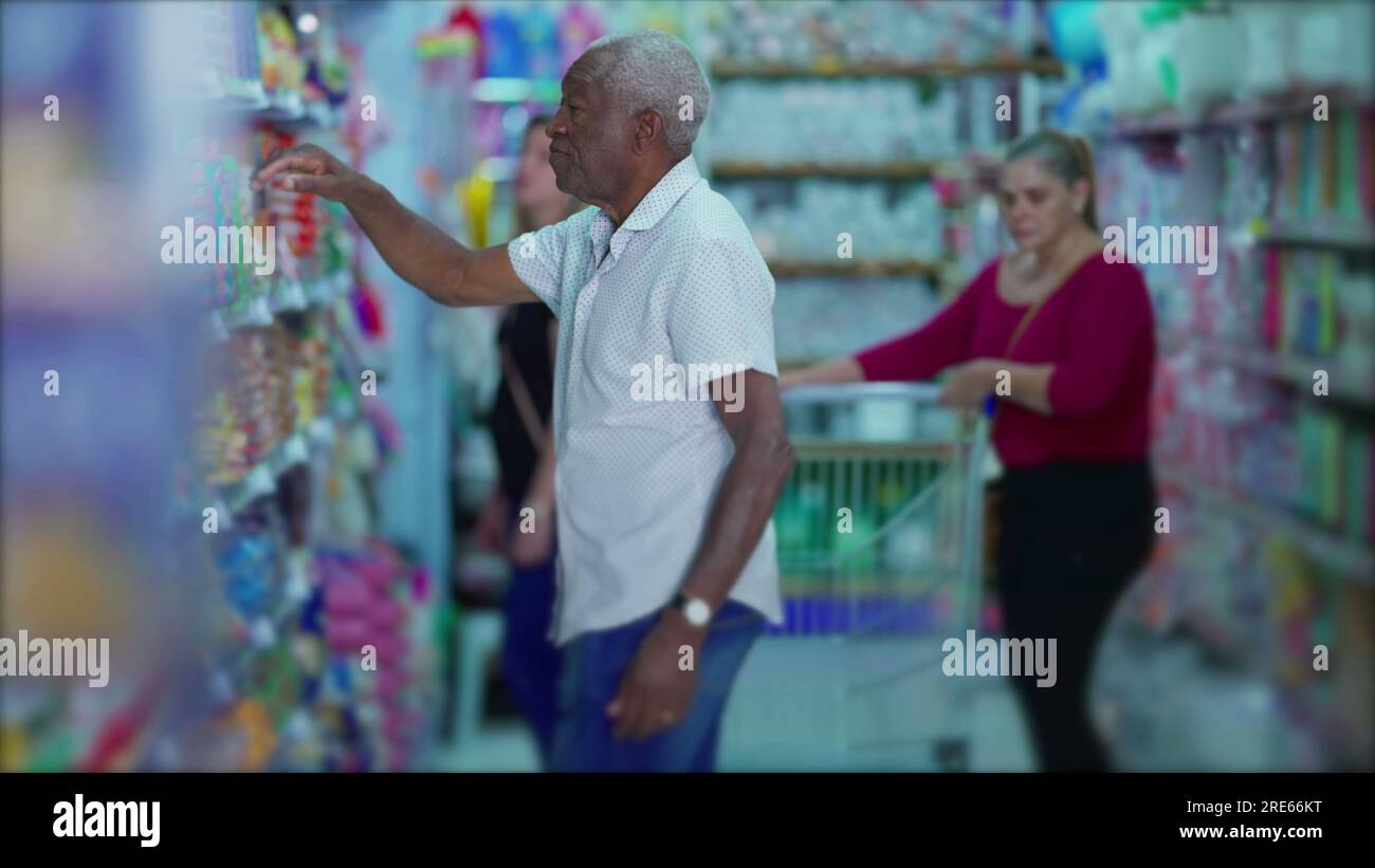 Customer shopping at grocery store isle. Diverse people searching for ...