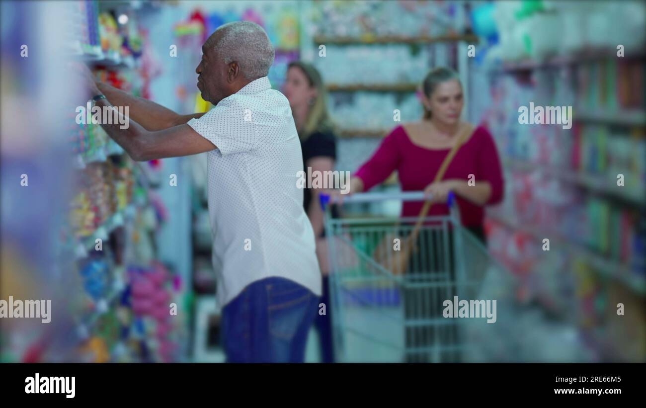 Customer shopping at grocery store isle. Diverse people searching for ...