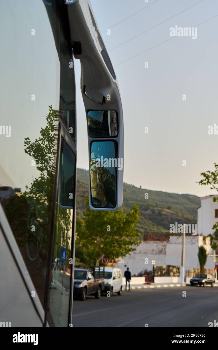 Mirror of Bus with reflection of tree Stock Photo - Alamy