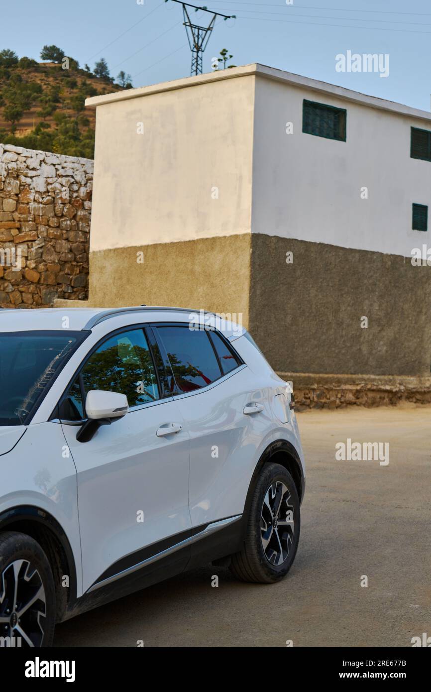 A part of white car beside building Stock Photo - Alamy