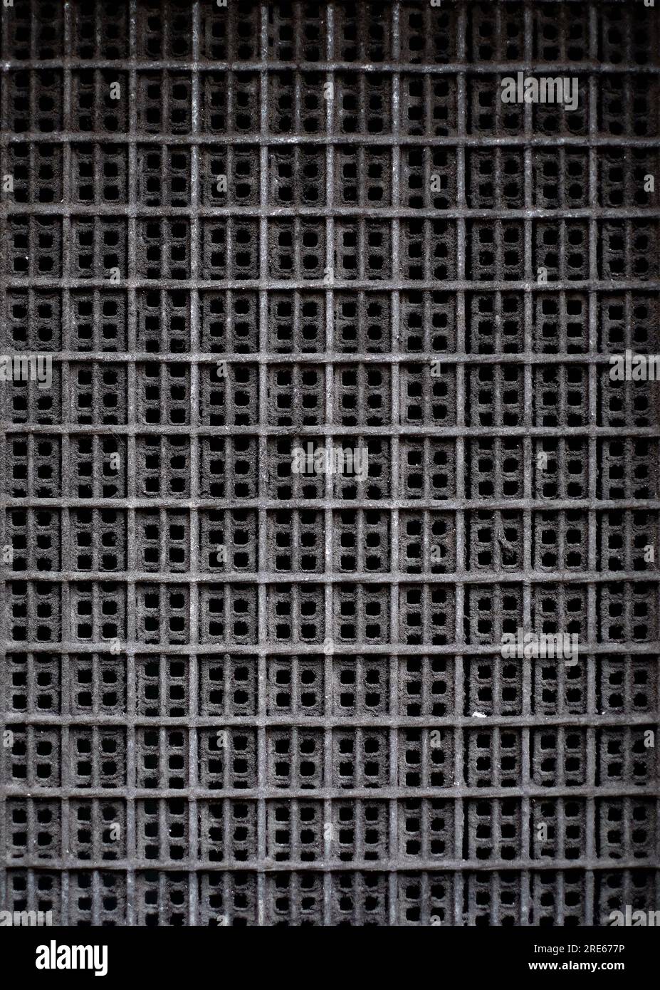 A dark rectangular pattern with repetitive square texture, an element ...