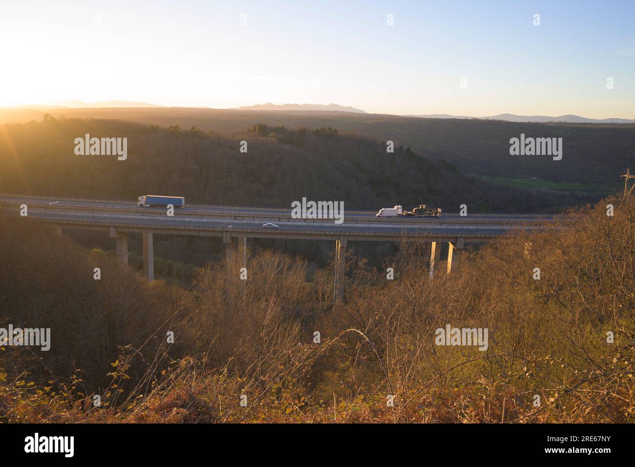 Highway viaduct at sunset with car and truck traffic on Autovia Ruta de ...