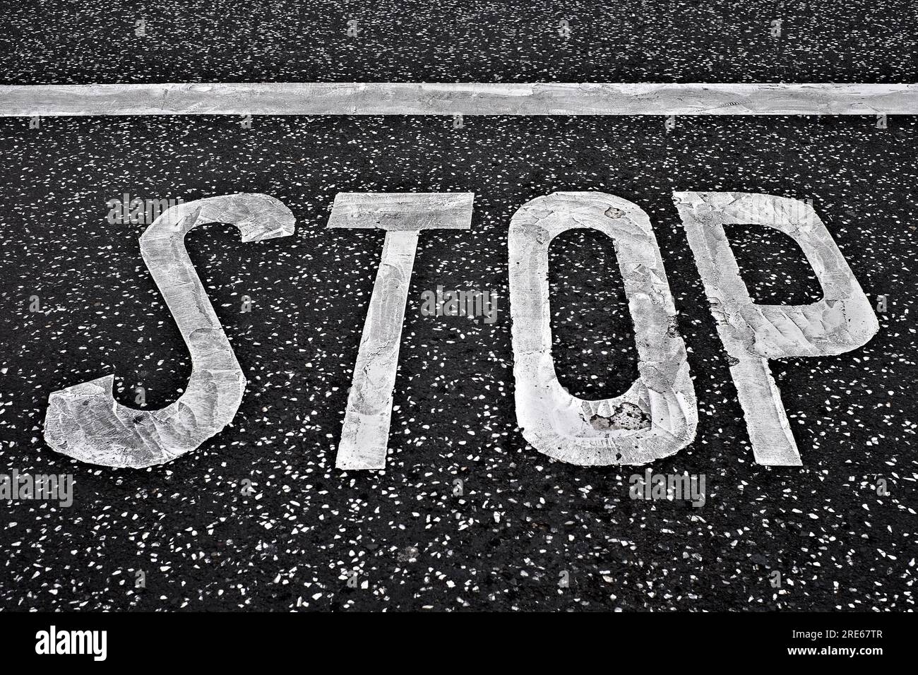 Word 'STOP' in large white letters on black background Stock Photo - Alamy