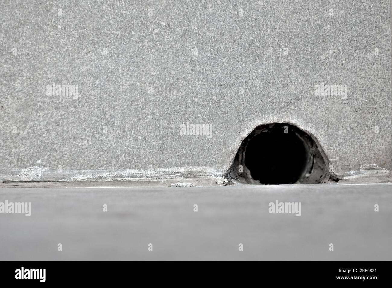 A mouse hole in a wall Stock Photo - Alamy