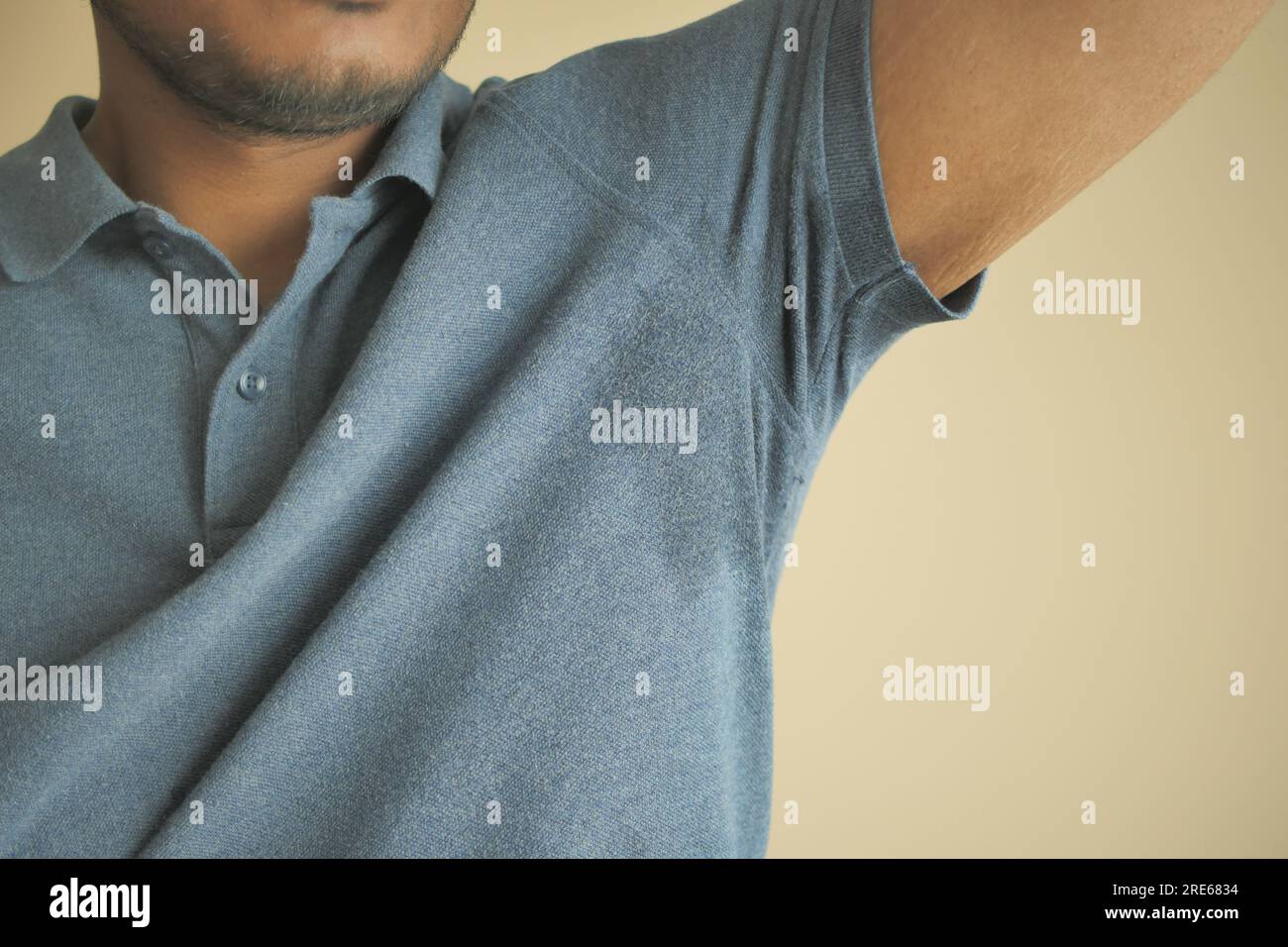 man with wet armpits Smelly odor from sweat Stock Photo - Alamy
