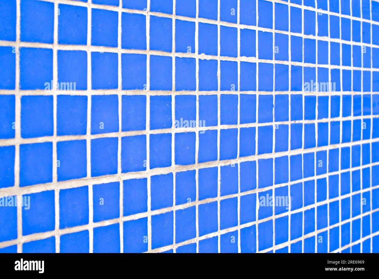 Pattern of fine small light blue tiles in angled perspective view Stock ...