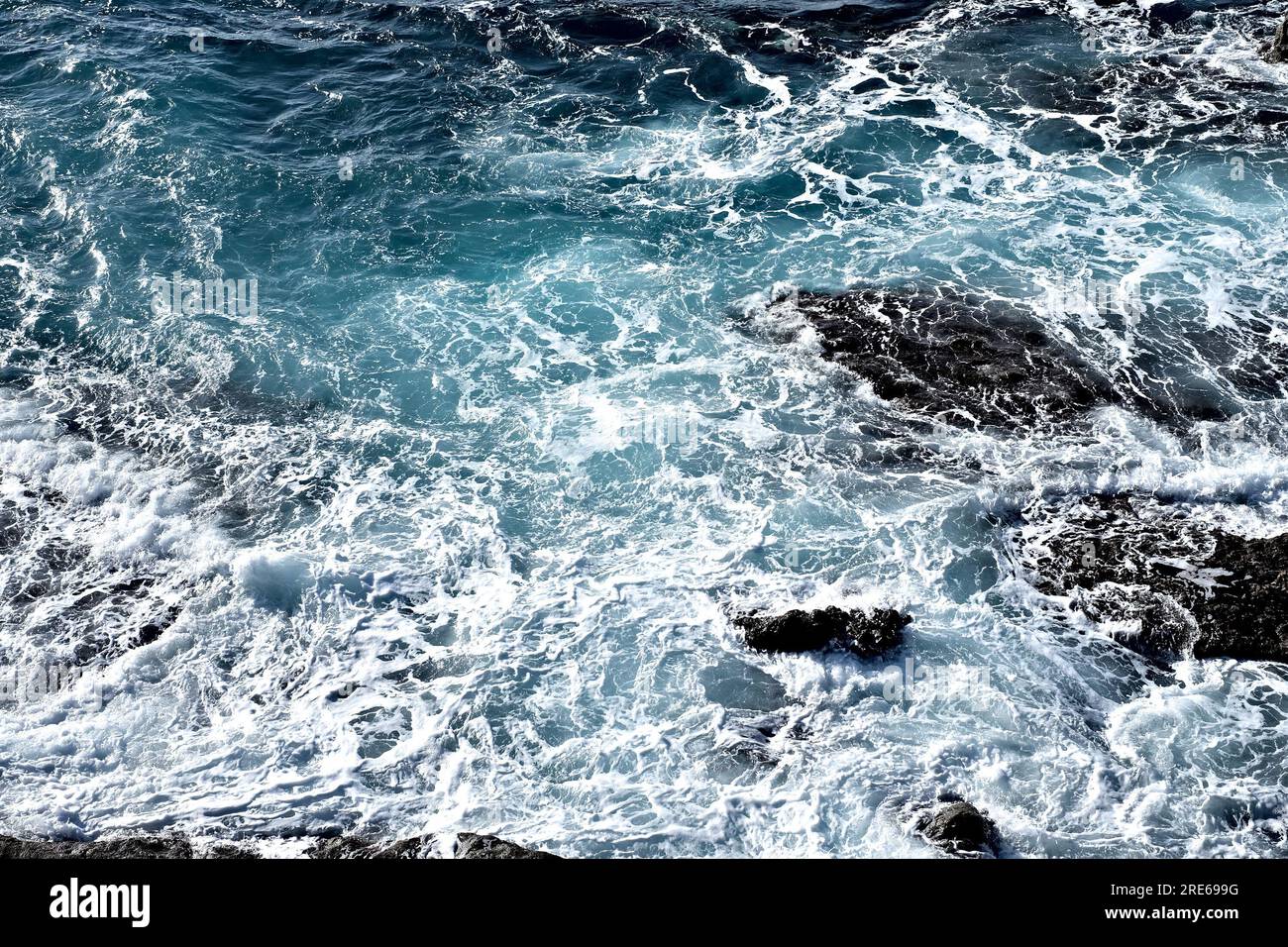 Stormy ocean waves, deep blue sea water with white foam and dark ...