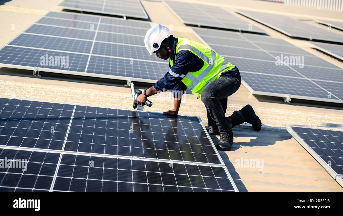 Engineers with safety helmet checking solar system at solar power farm ...