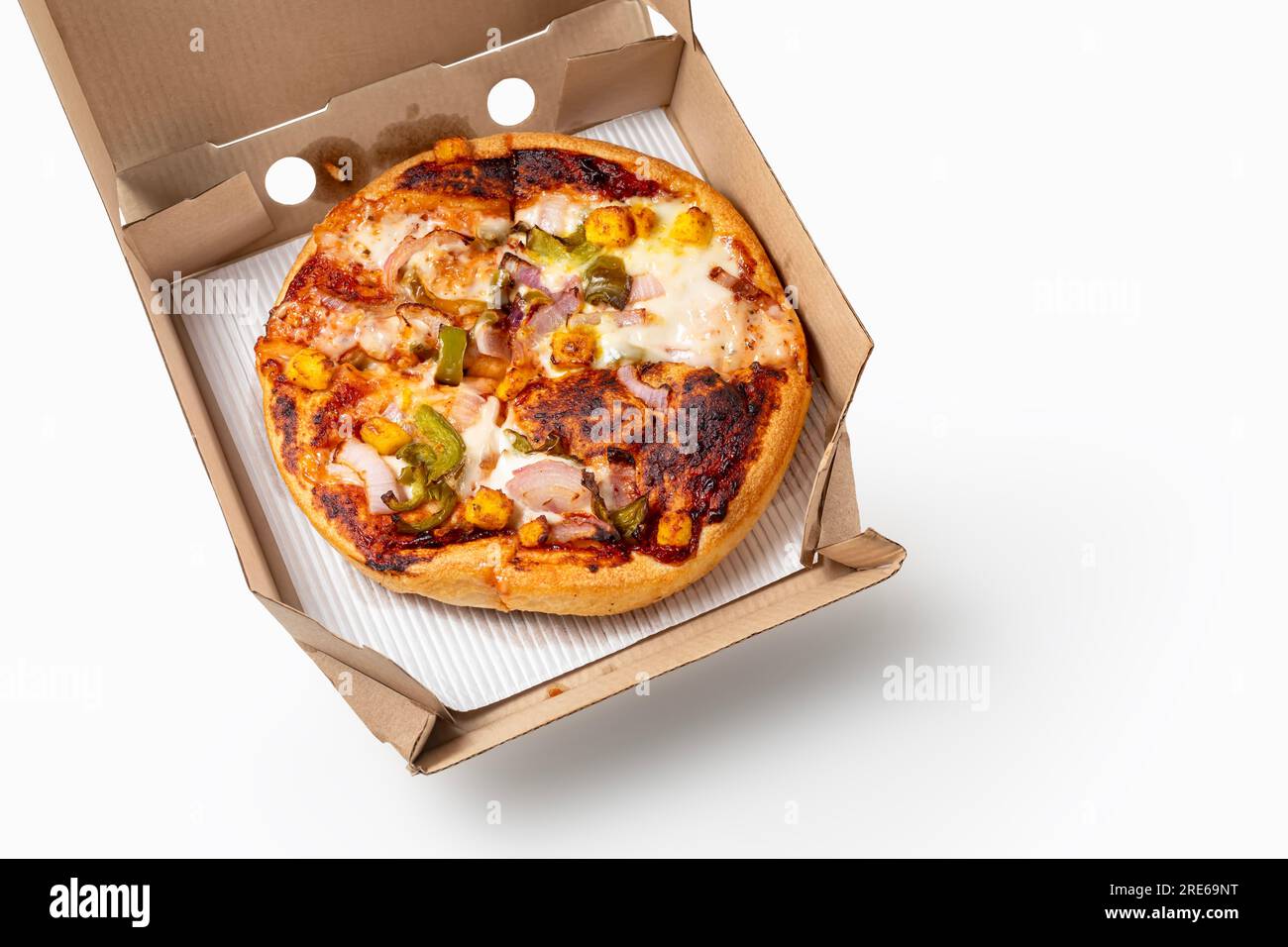 Paneer pizza in open delivery box in cardboard box on white background ...