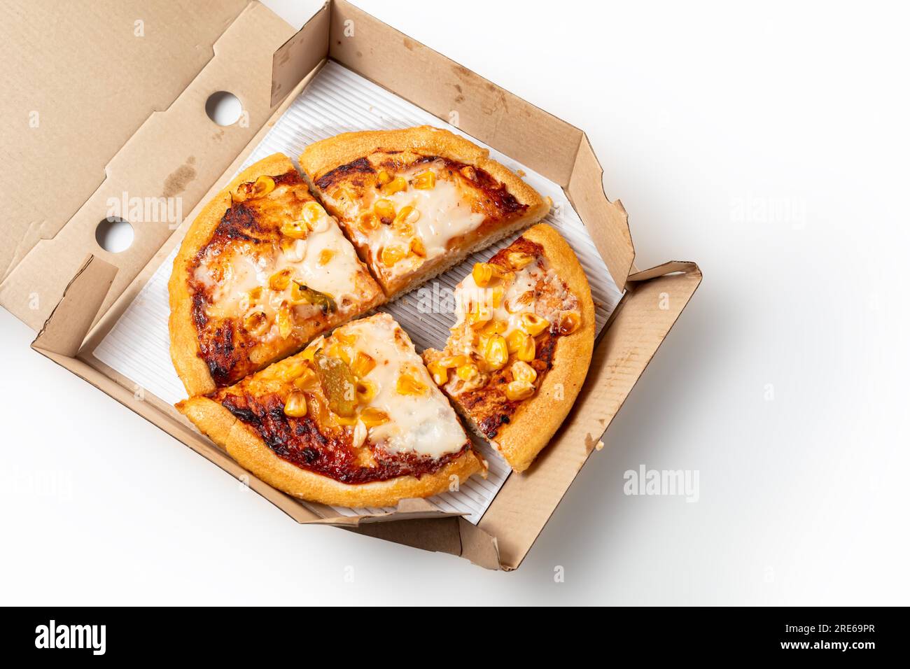 Top view of sliced hot delicious corn pizza box Stock Photo - Alamy
