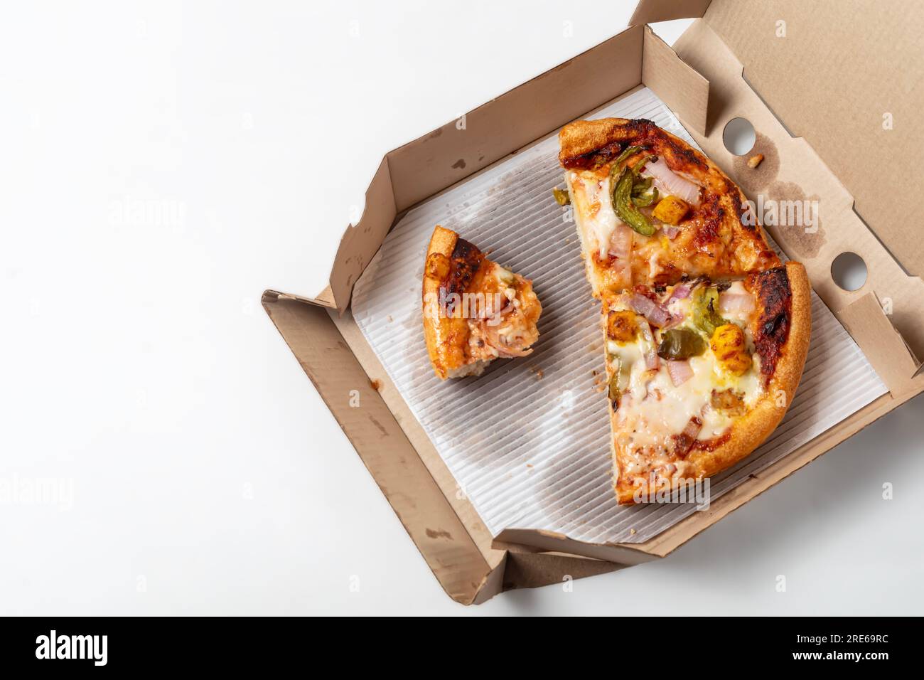 Two different leftover pizza in open cardboard box isolated on white ...