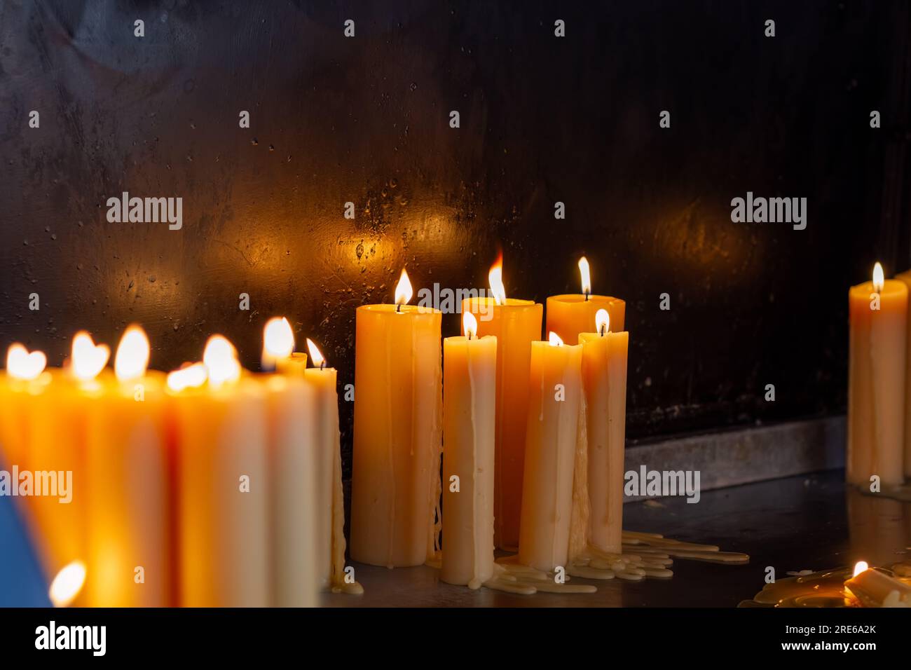 Candles in fire on black background Stock Photo - Alamy