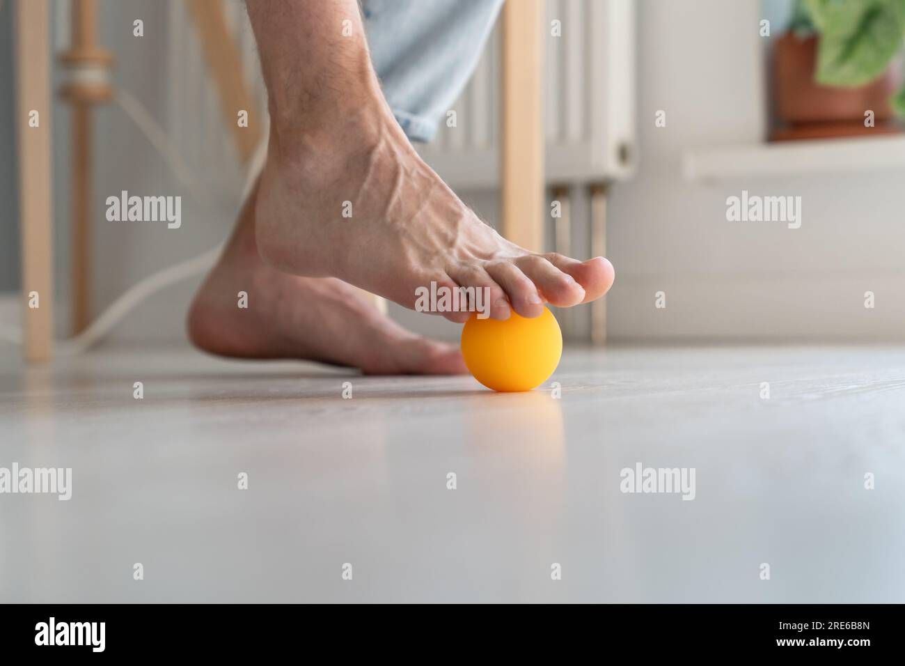 Massaging feet ball hi-res stock photography and images - Alamy