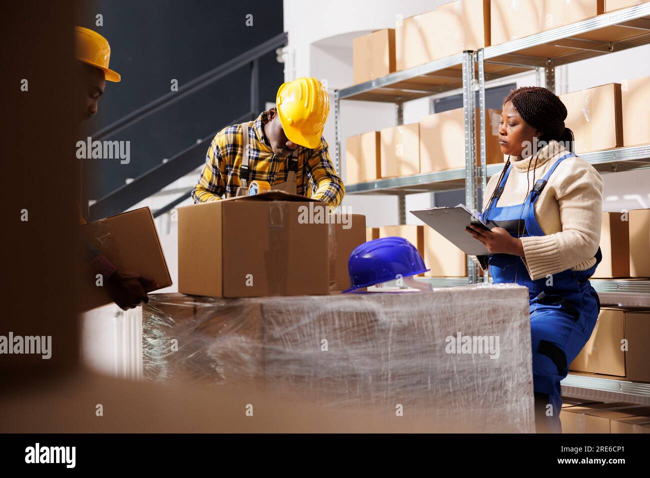 African warehouse worker packing hi-res stock photography and images ...