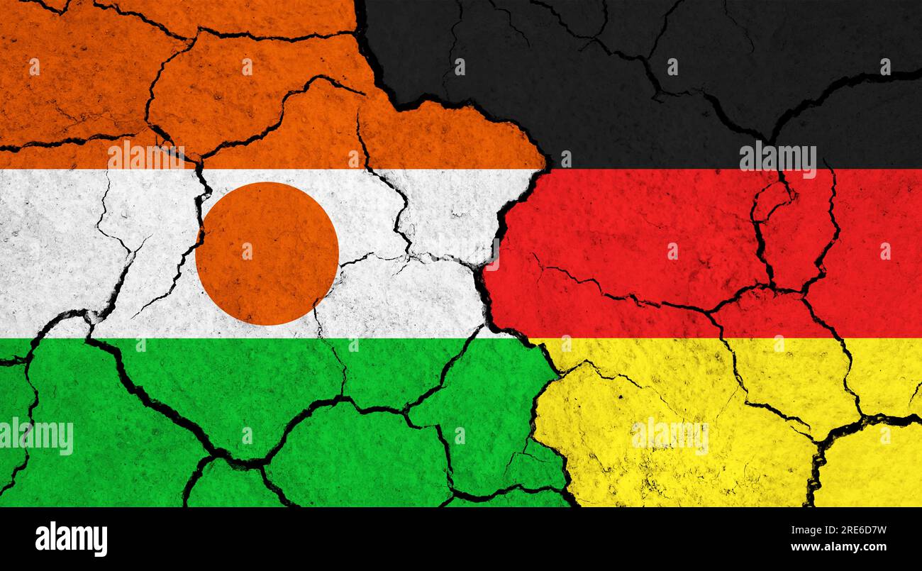 Flags of Niger and Germany on cracked surface - politics, relationship ...