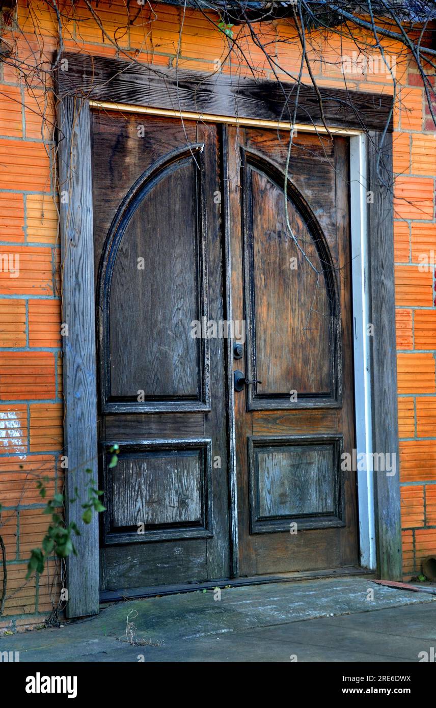 Creepy door looks haunted and ghostly. It is weathered, cracked and ...
