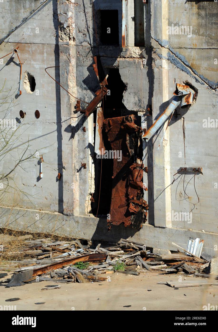 Crushed and wrecked metal door is useless to prevent anyone from ...