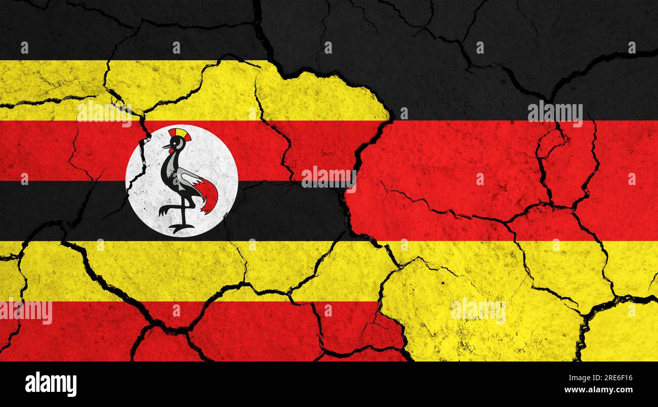 Flags of Uganda and Germany on cracked surface - politics, relationship ...