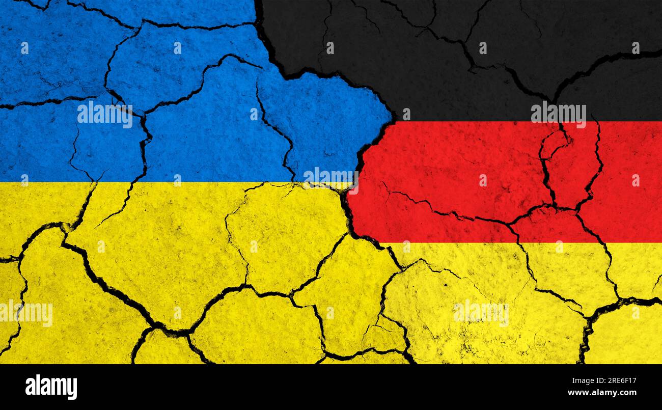 Flags of Ukraine and Germany on cracked surface - politics ...