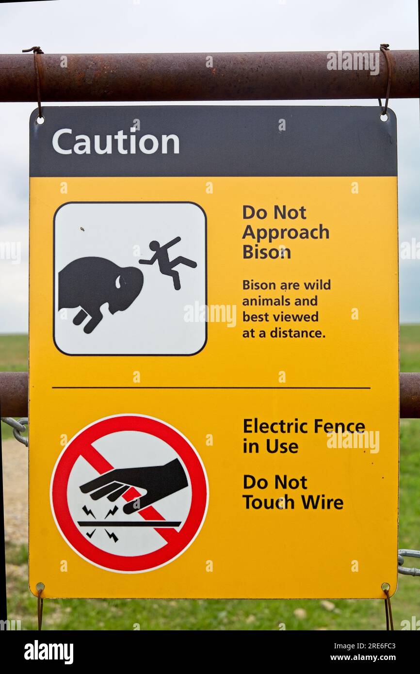 Caution sign on gate into grazing pastures of American bison at ...