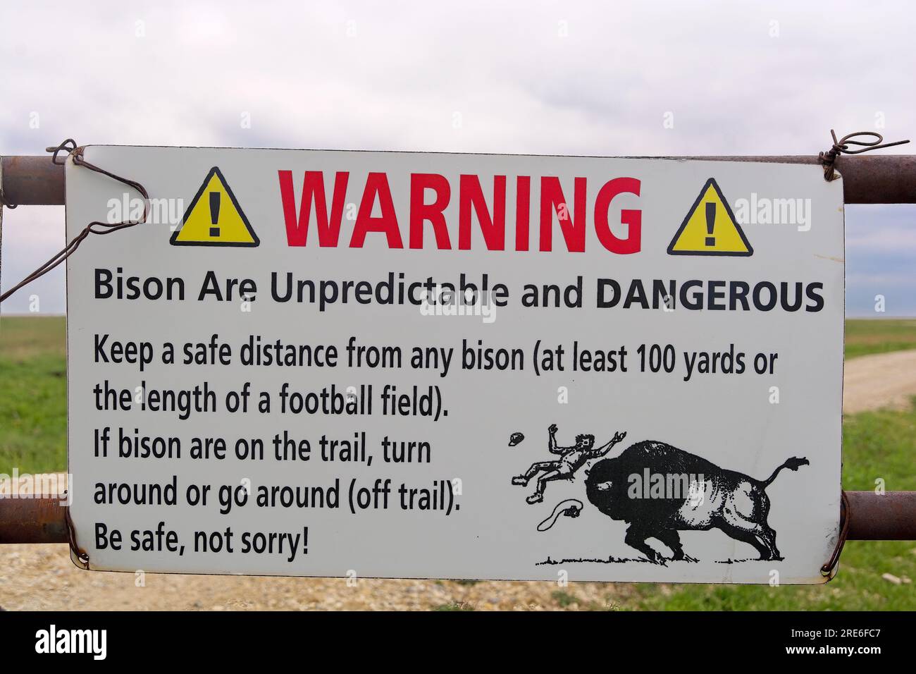 Warning sign of danger on gate into grazing pastures of American bison ...