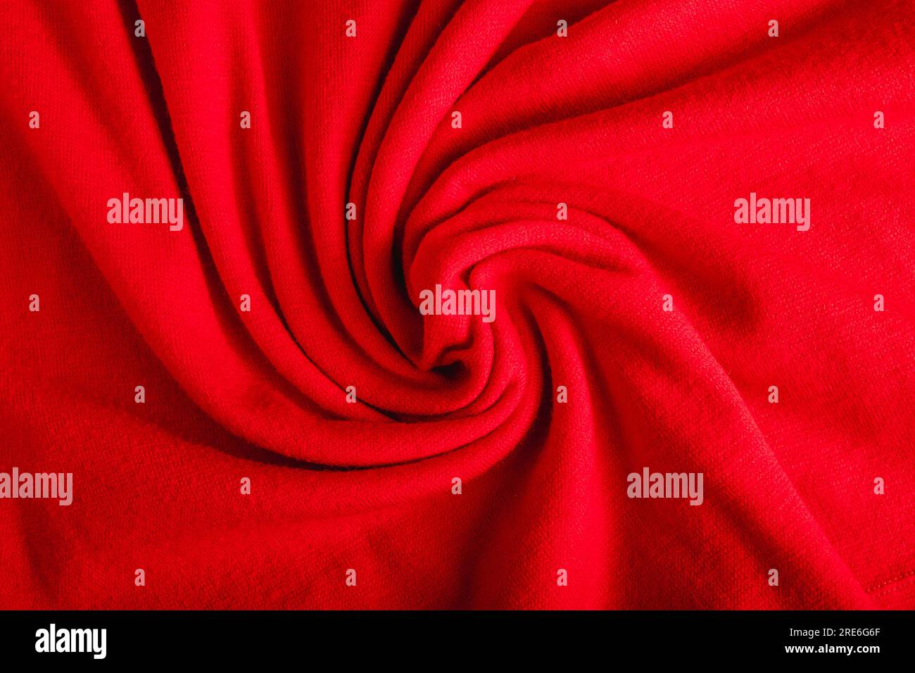 Red woolen fabric for sewing. Textile background. Folds on natural ...