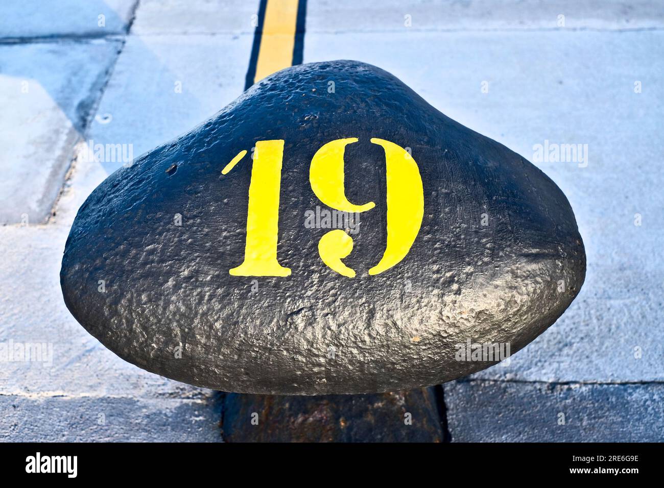 Number 19, nineteen, stencil yellow digit painted on a big commercial ...