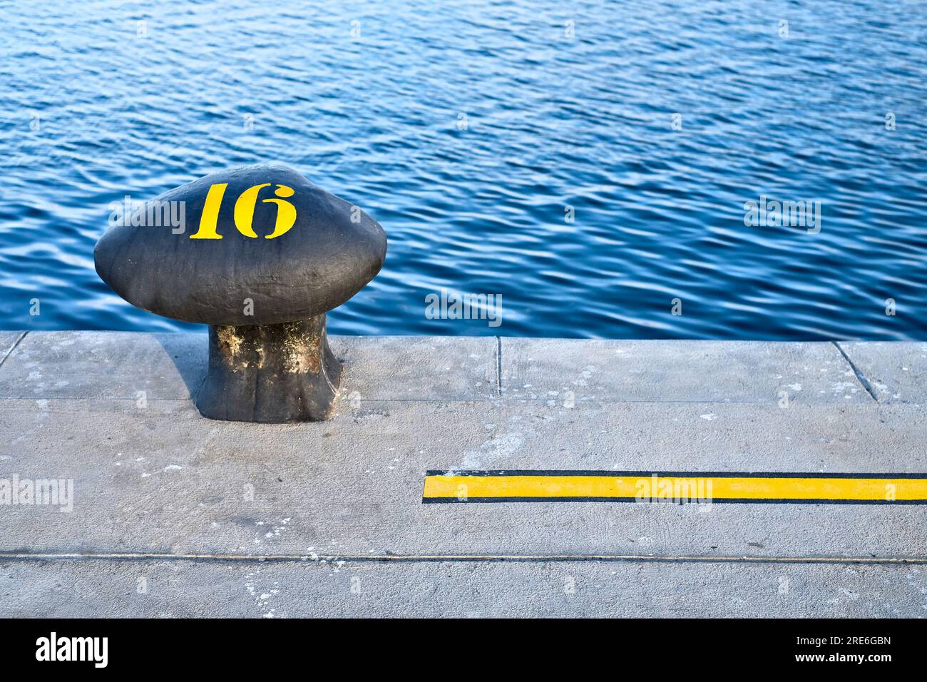 Number 16, sixteen, stencil yellow digit painted on a big commercial ...