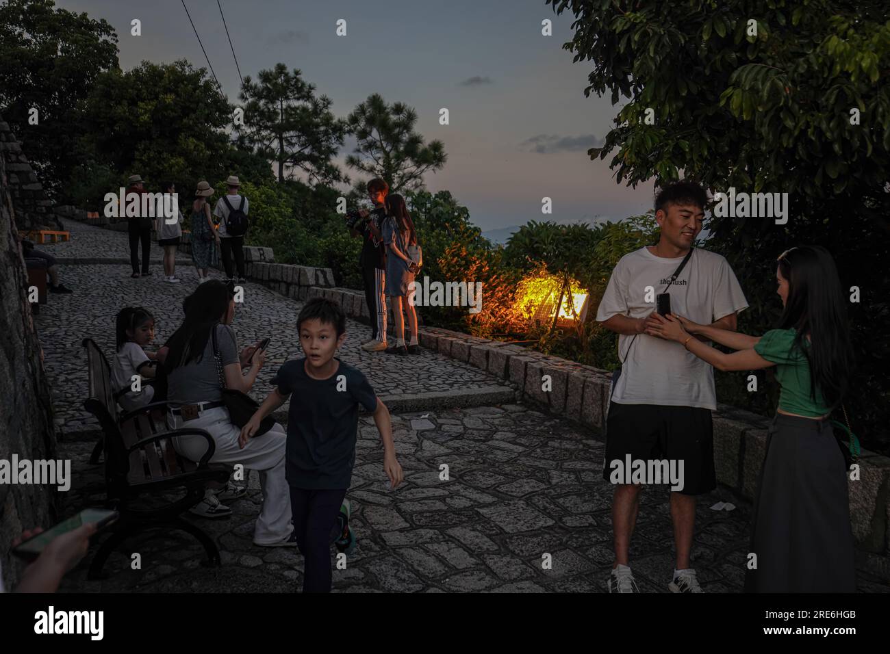 Macau, China. 24th July, 2023. People play at Guia Lighthouse in Macau ...