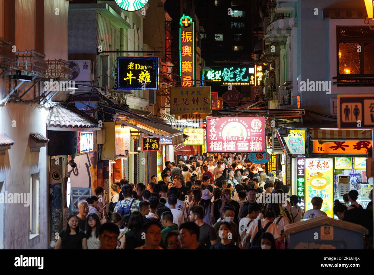 Macau, China. 24th July, 2023. People walk on R. do Cunha, one of the ...