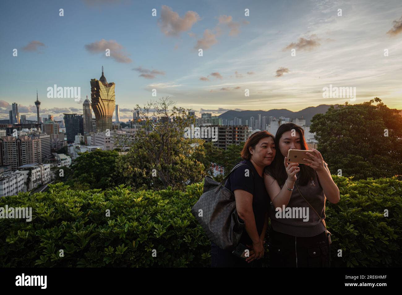 Macau, China. 24th July, 2023. Tourists take selfies at Guia Lighthouse ...