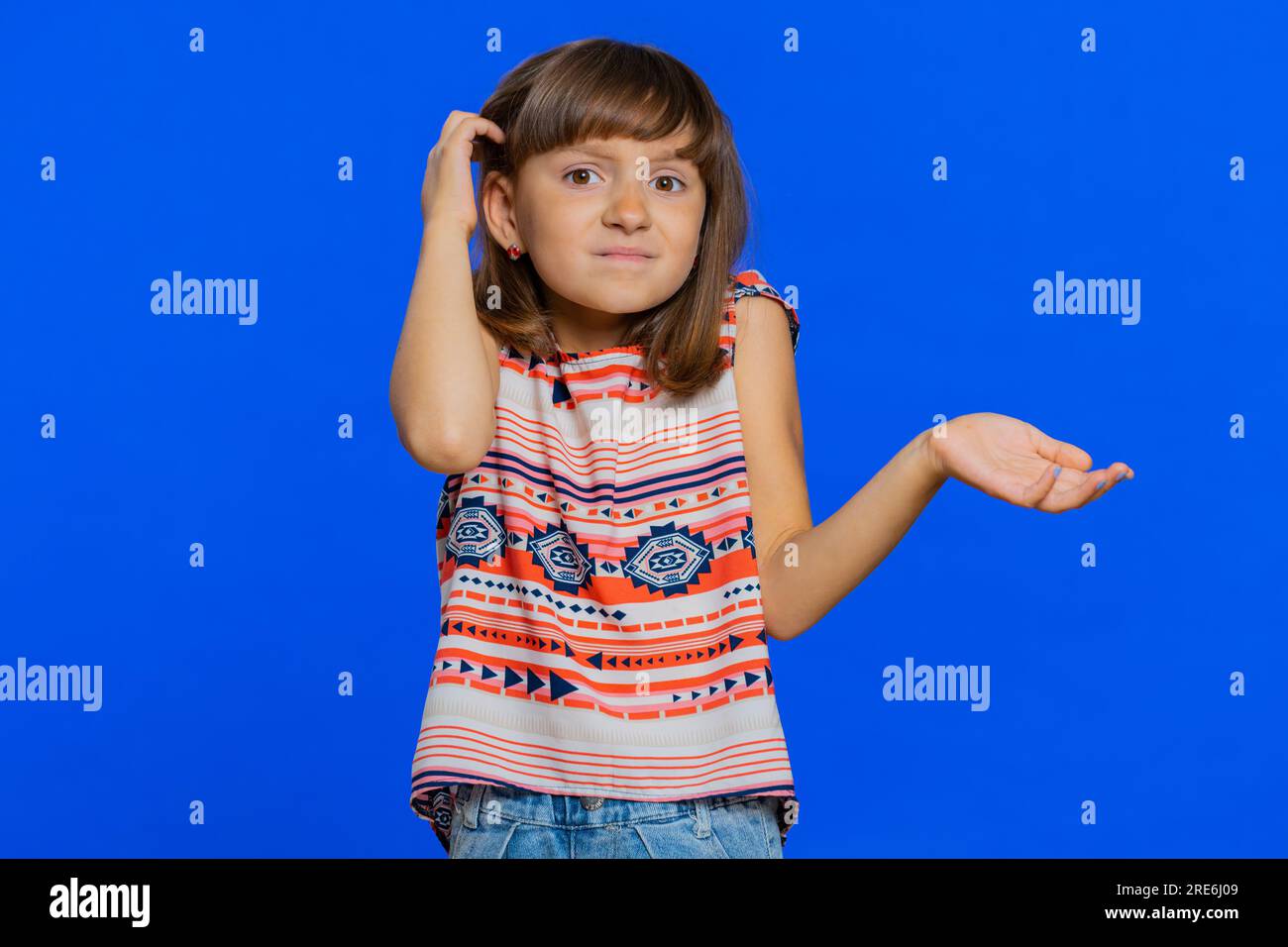 I dont know what to say. Confused young school girl feeling embarrassed ...