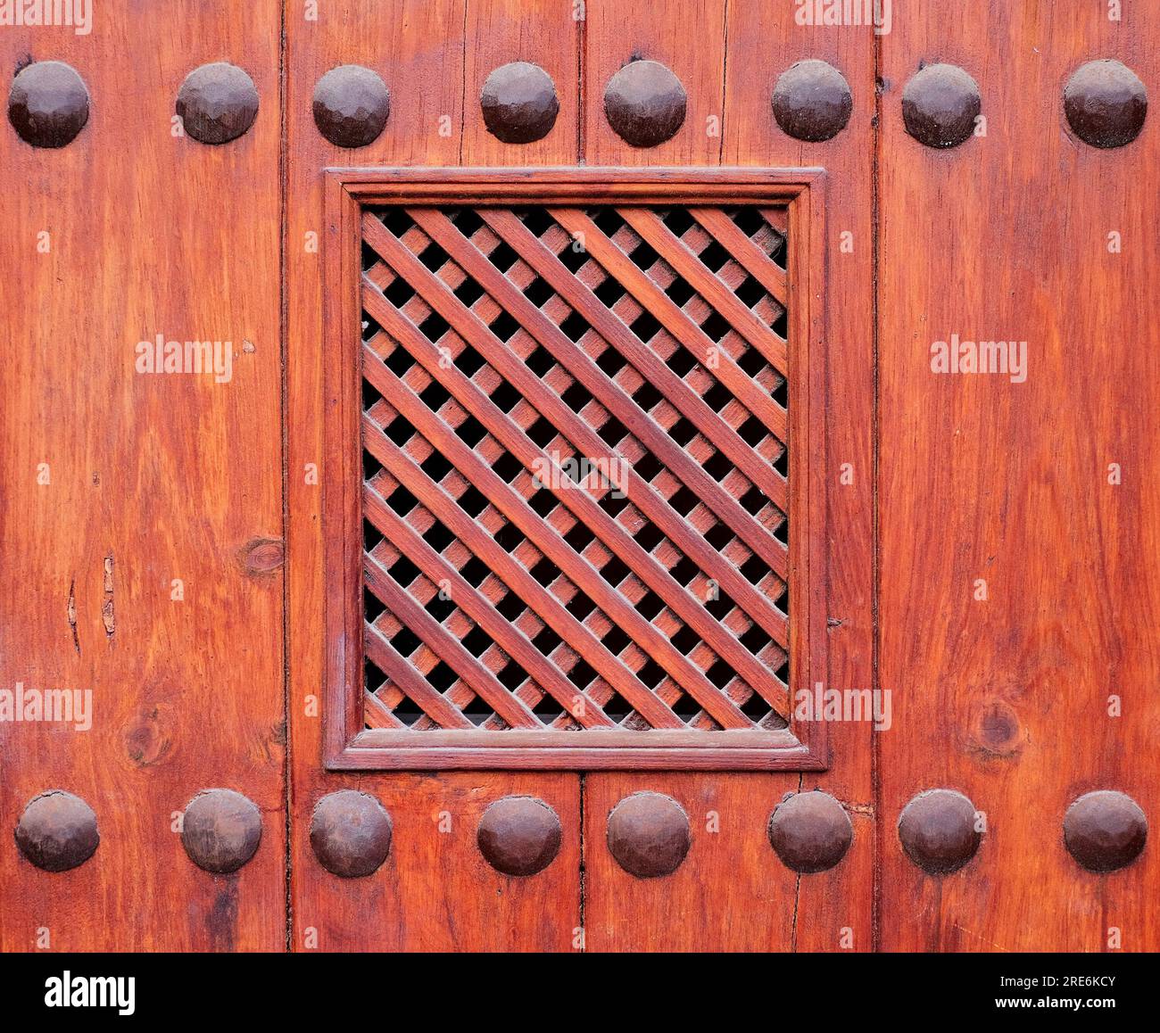 Latticed window in classic old timber door Stock Photo - Alamy