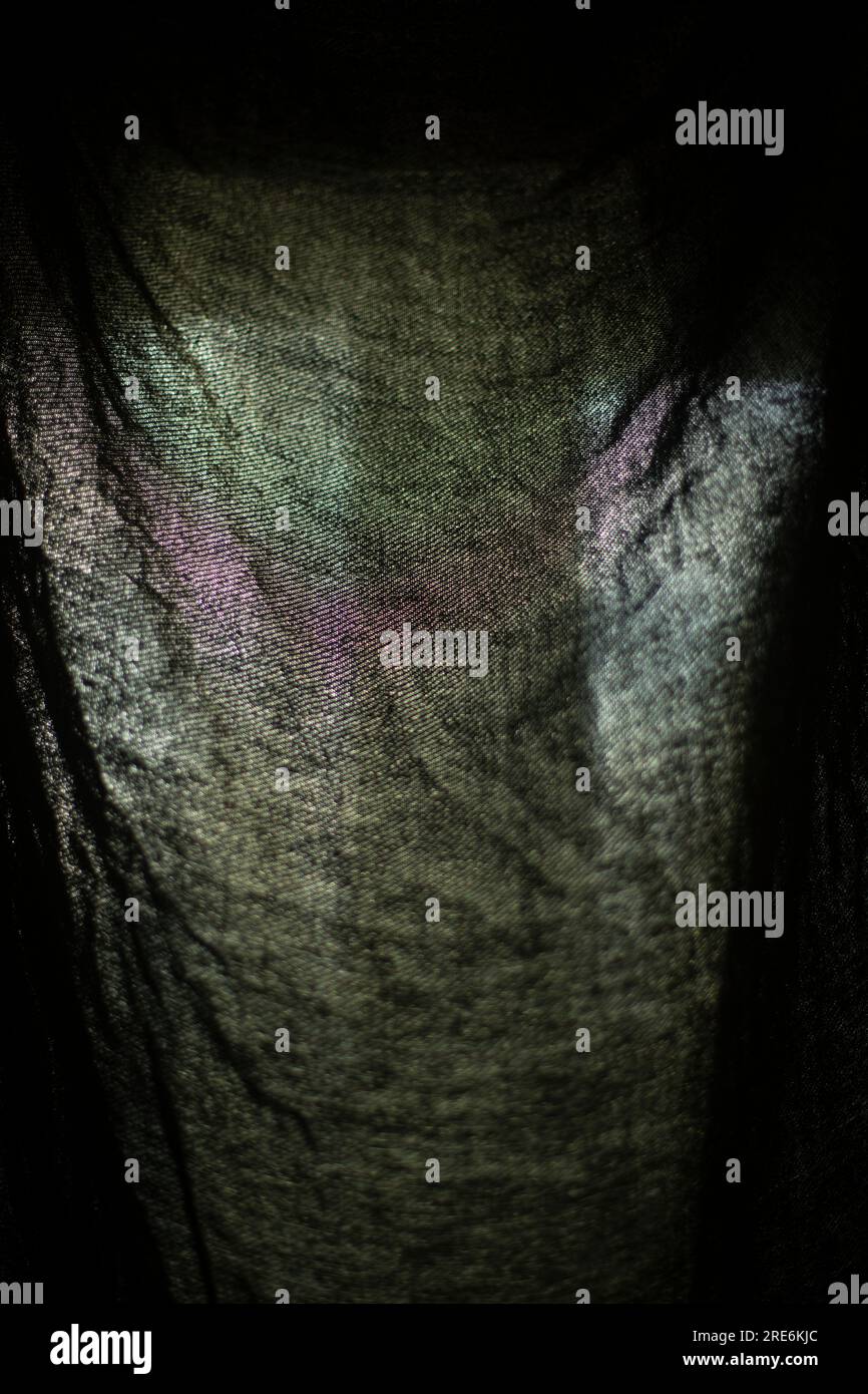 Texture of dark fabric. Fabric to light. Black background. Details of ...