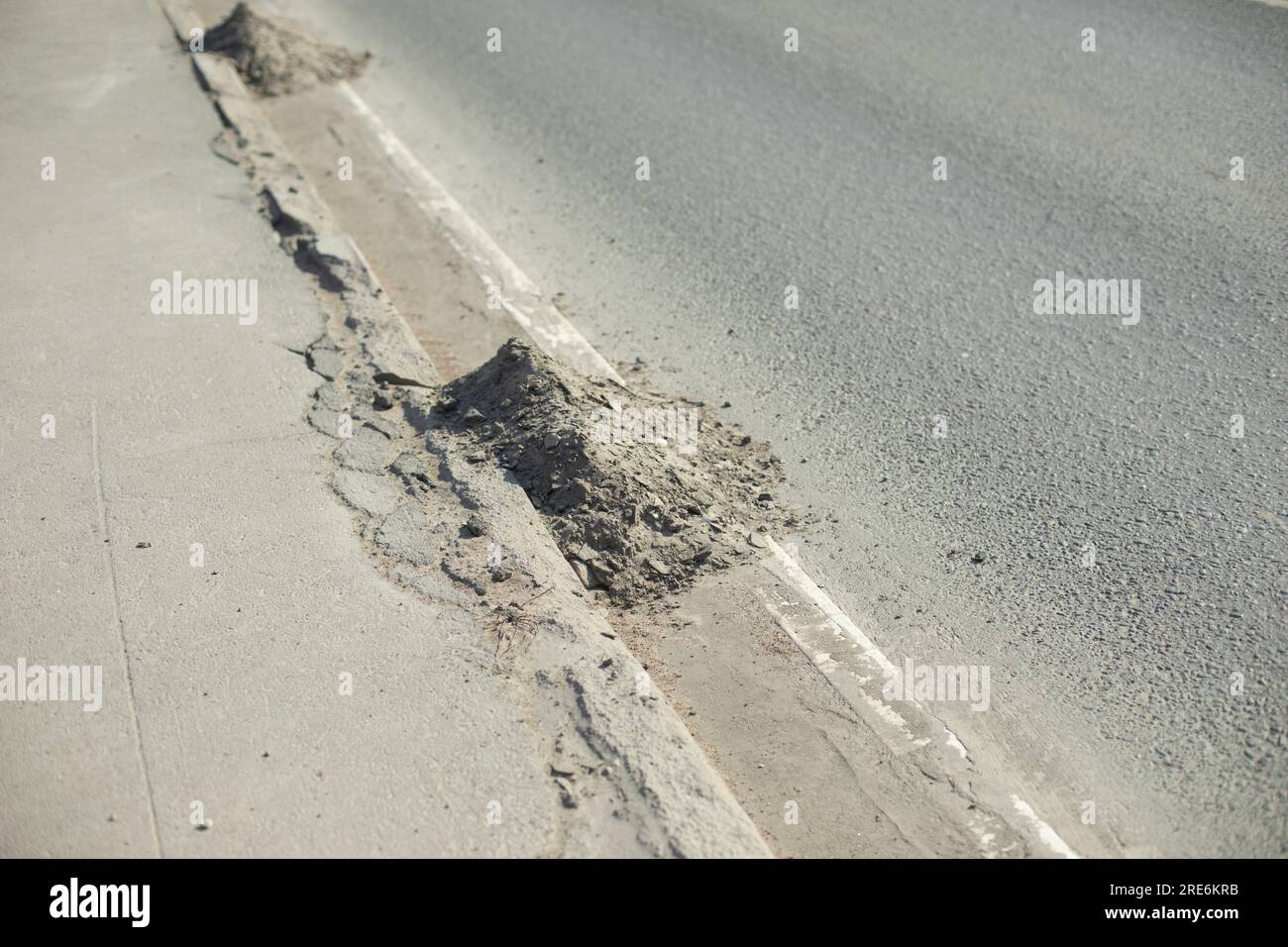 Dirt on road. Dust at curb. Asphalt cleaning. Swept away garbage Stock ...