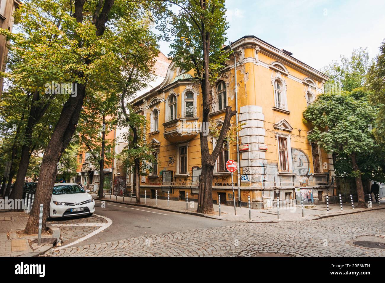 an historic building on the corner of a leafy street in Sofia, Bulgaria ...