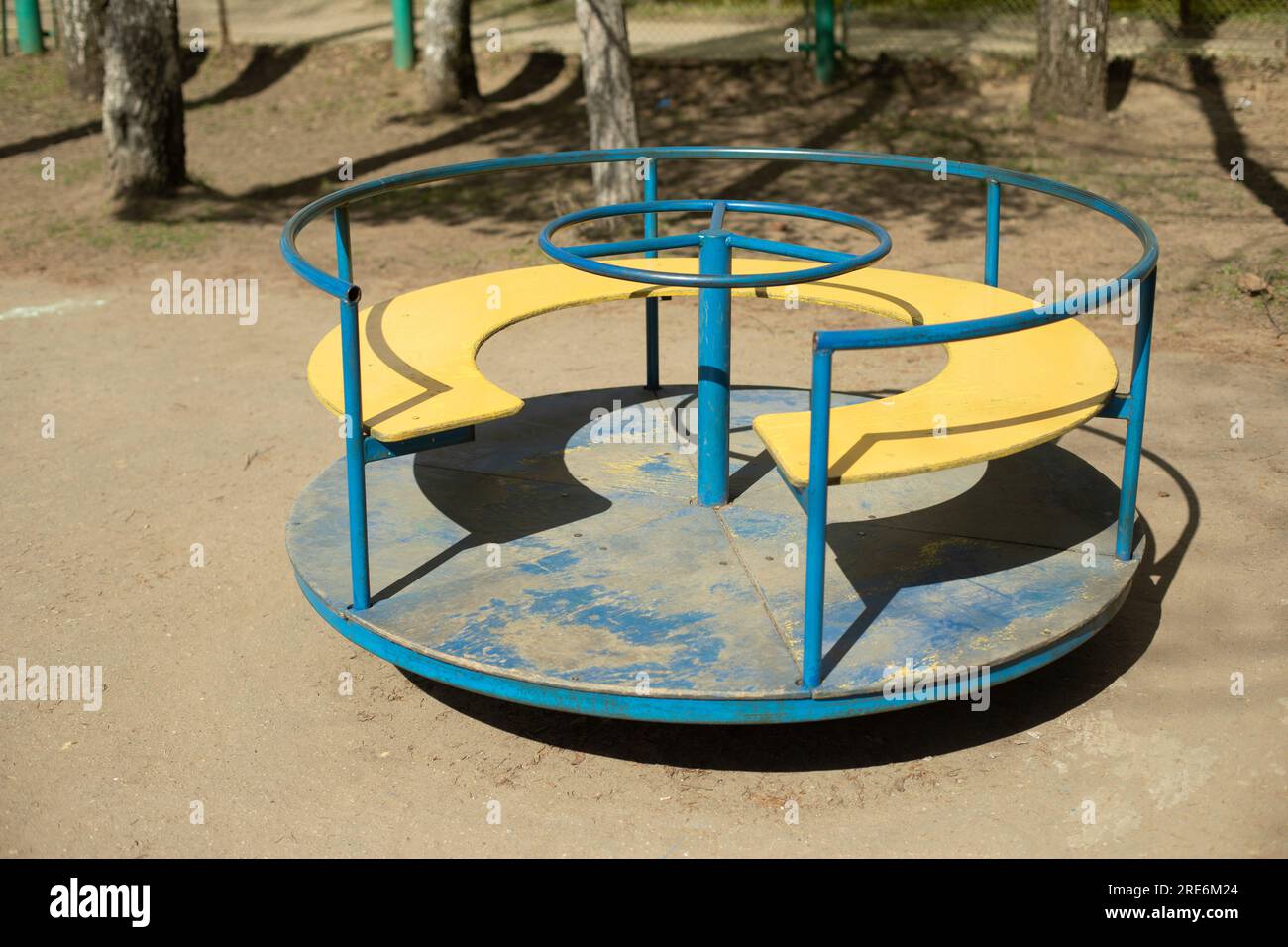 Children's playground. Carousel on street. Play Area. Old playground ...